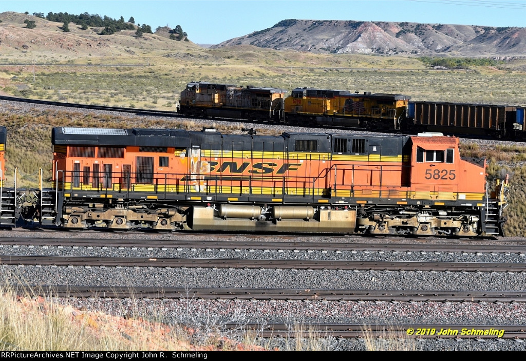 BNSF 5825 (GE ES44AC) at Nacco Jct WY , an empty UP unit coal train heads for the Jacob Ranch ...